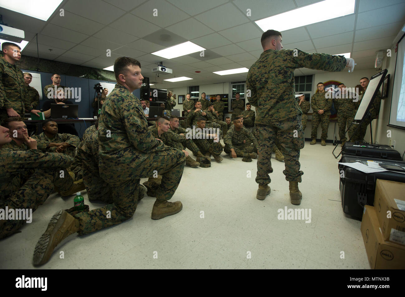 U.S. Marine Corps Cpl. Daniel G. Dellinger III, right, a squad leader ...