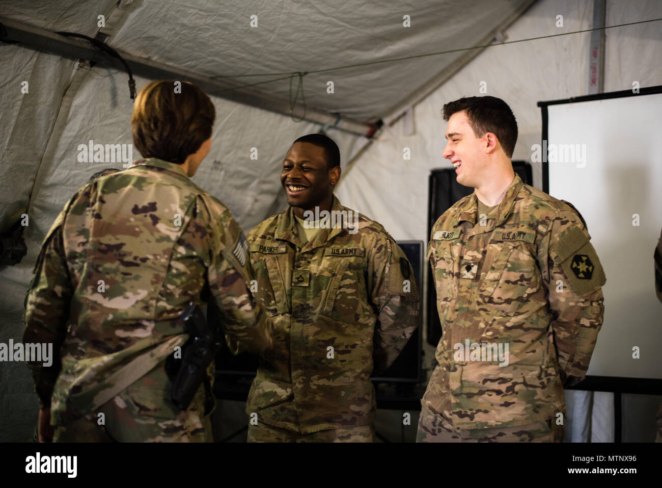 U.S. Army Spc. Marcus Huot, right, 456th Area Support Medical Company ...