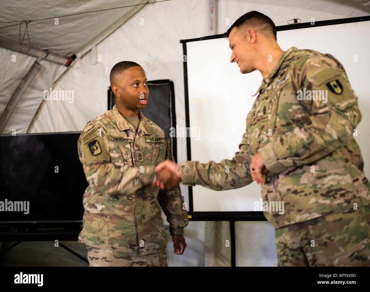 U.S. Army Sgt. 1st Class Alan Simmons, left, 28th Combat Support ...