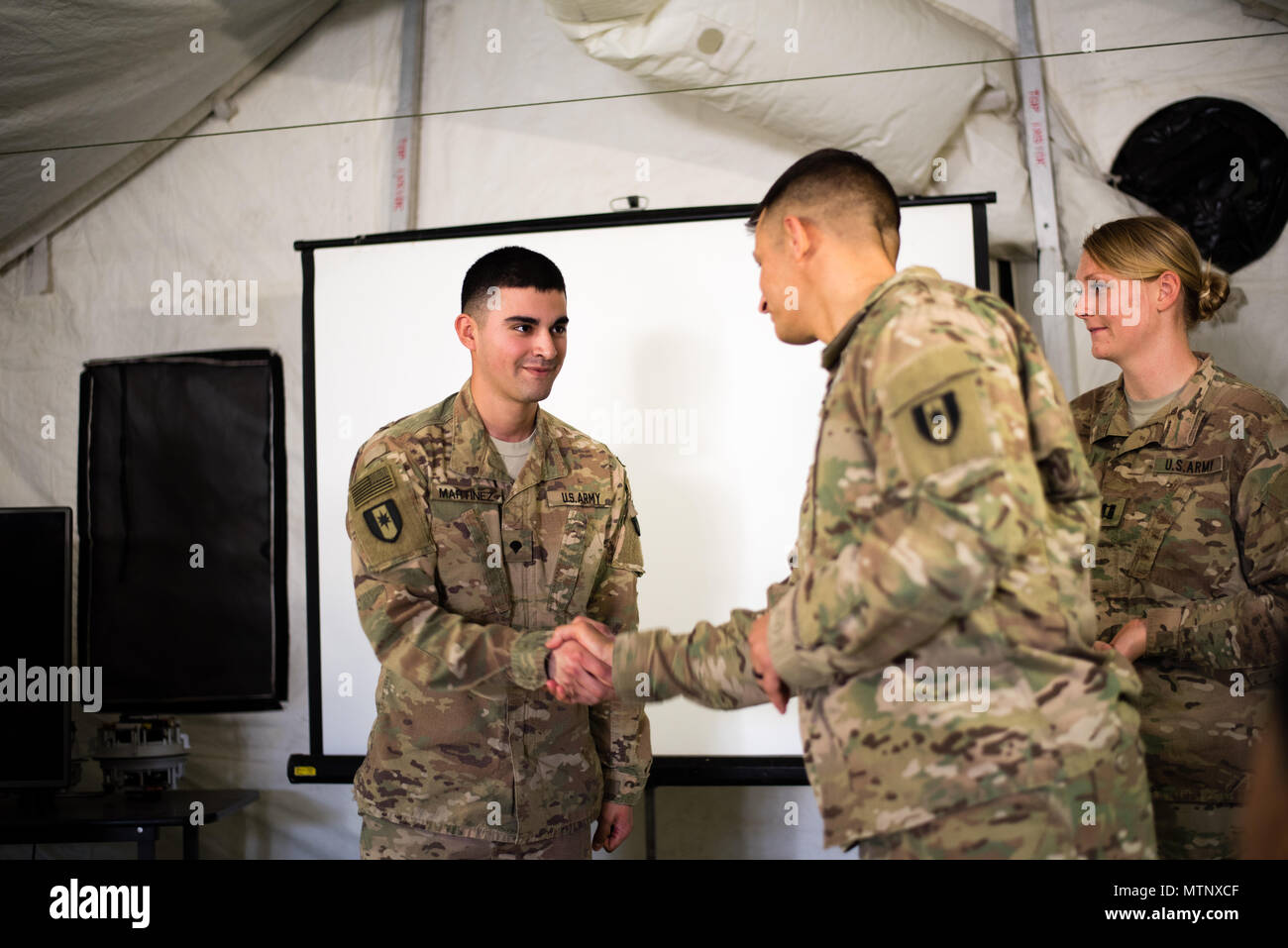 U.S. Army Spc. Michael Martinez, left, 28th Combat Support Hospital ...