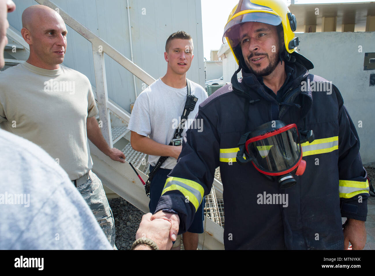 A French Air Force firefighter celebrates with U.S. Air Force ...