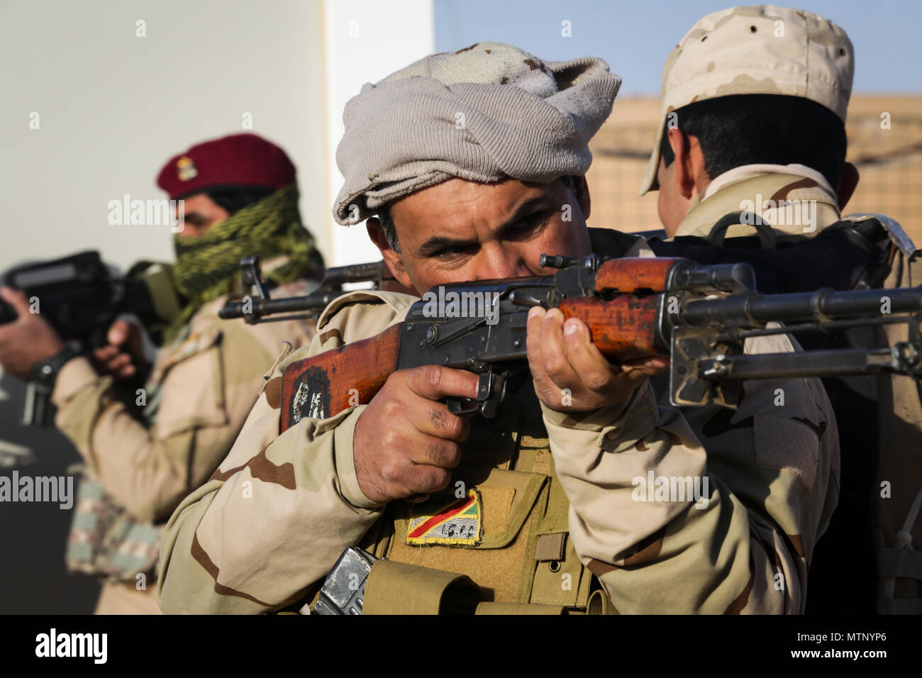 An Iraqi soldier from 7th Iraqi Army Division provides rear security ...