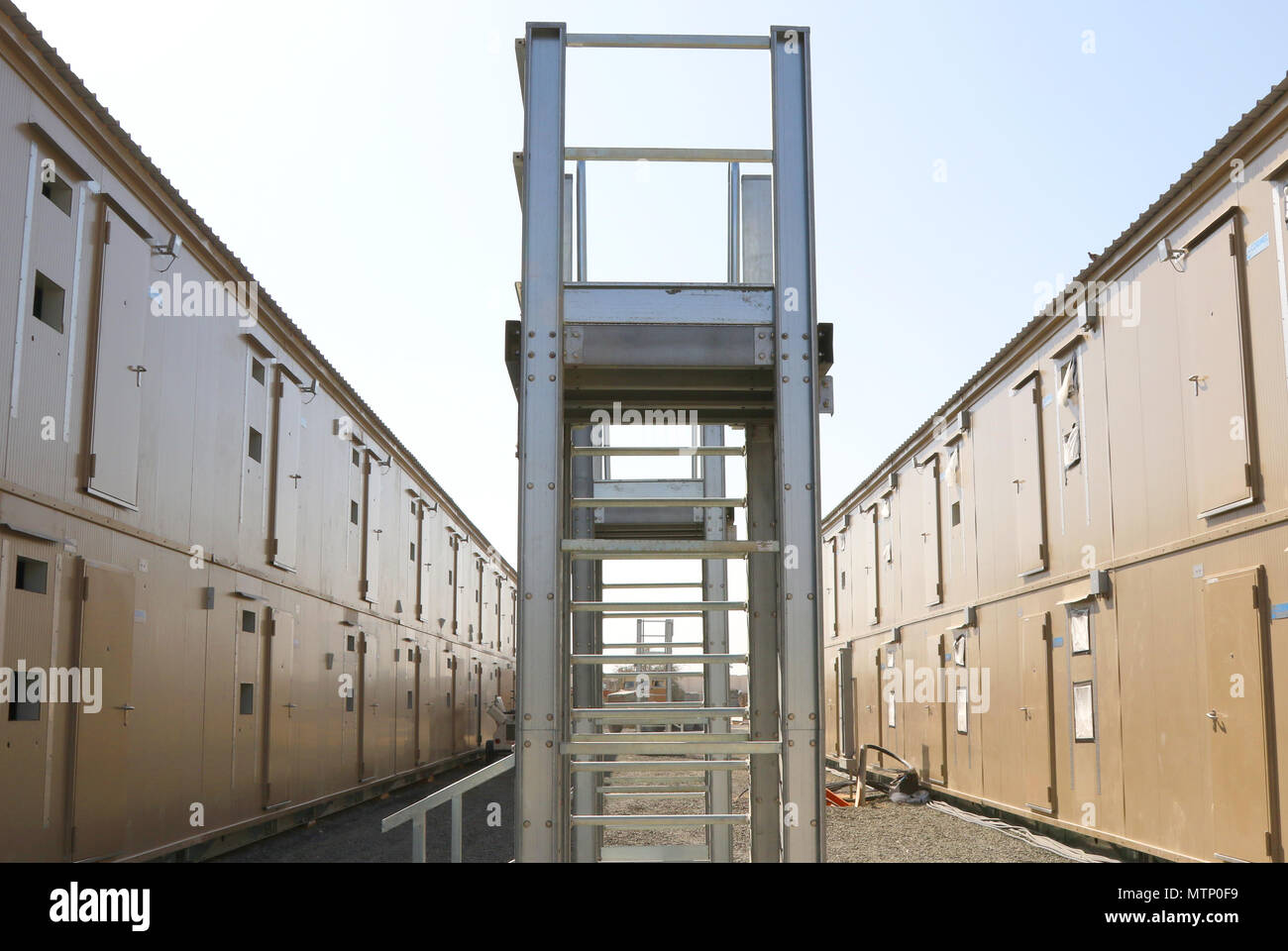 When completed this two- story steel- frame modular unit has the ...