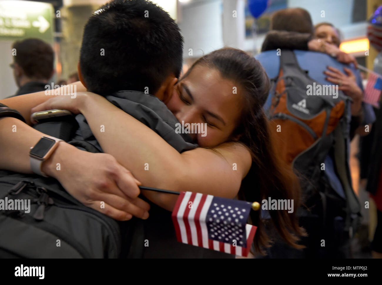Sonia Munn embraces her spouse following his return from a deployment ...