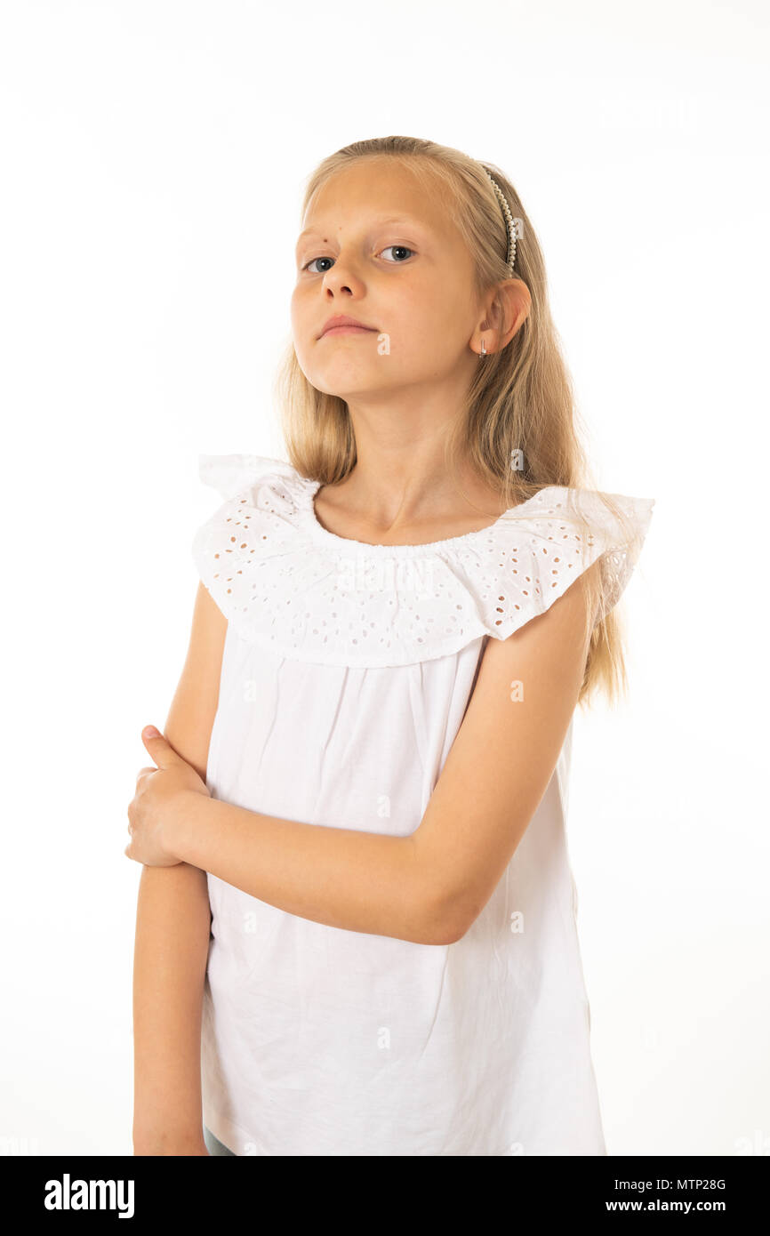 Close up portrait. Cute happy, confident, successful, proud little girl looking at the camera ...