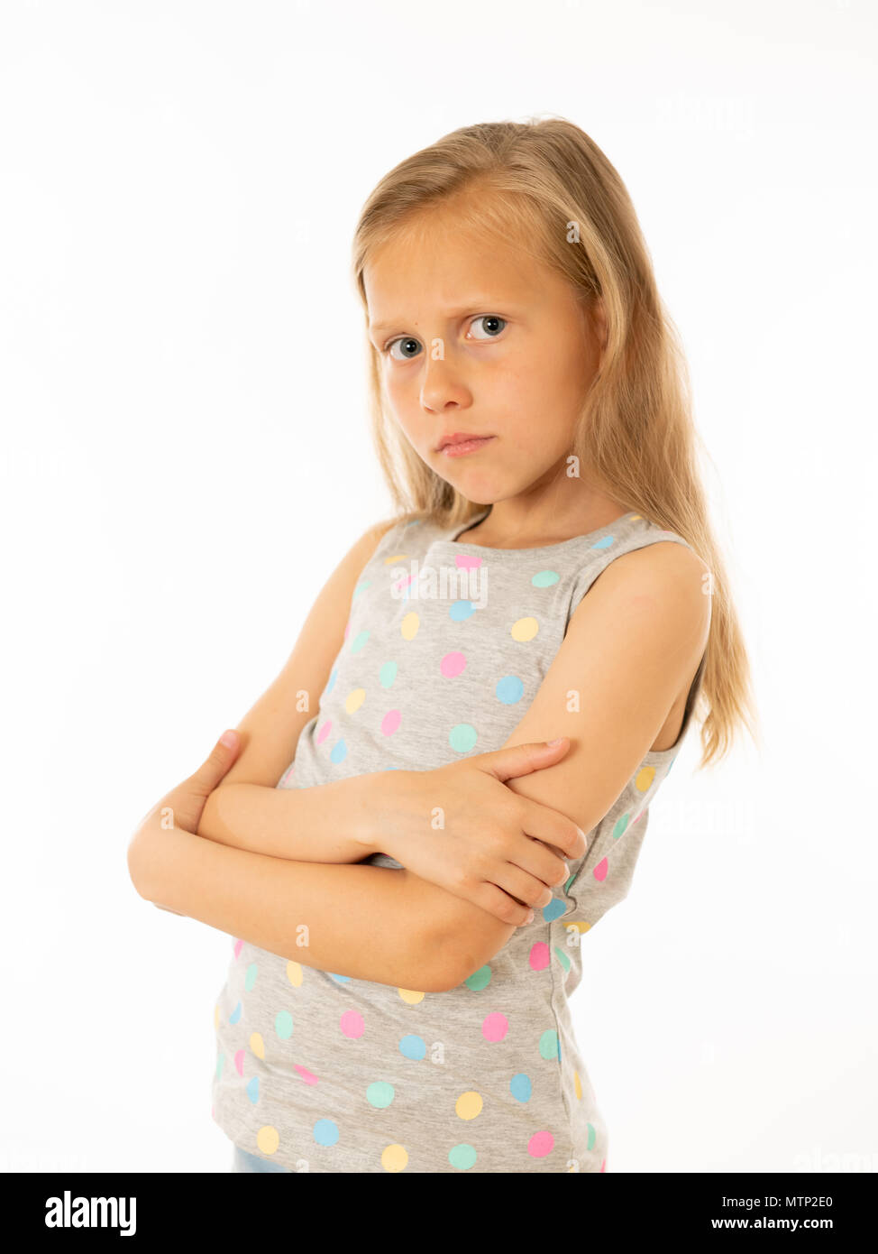 Close up portrait of a cute pretty child looking angry and disappointed ...
