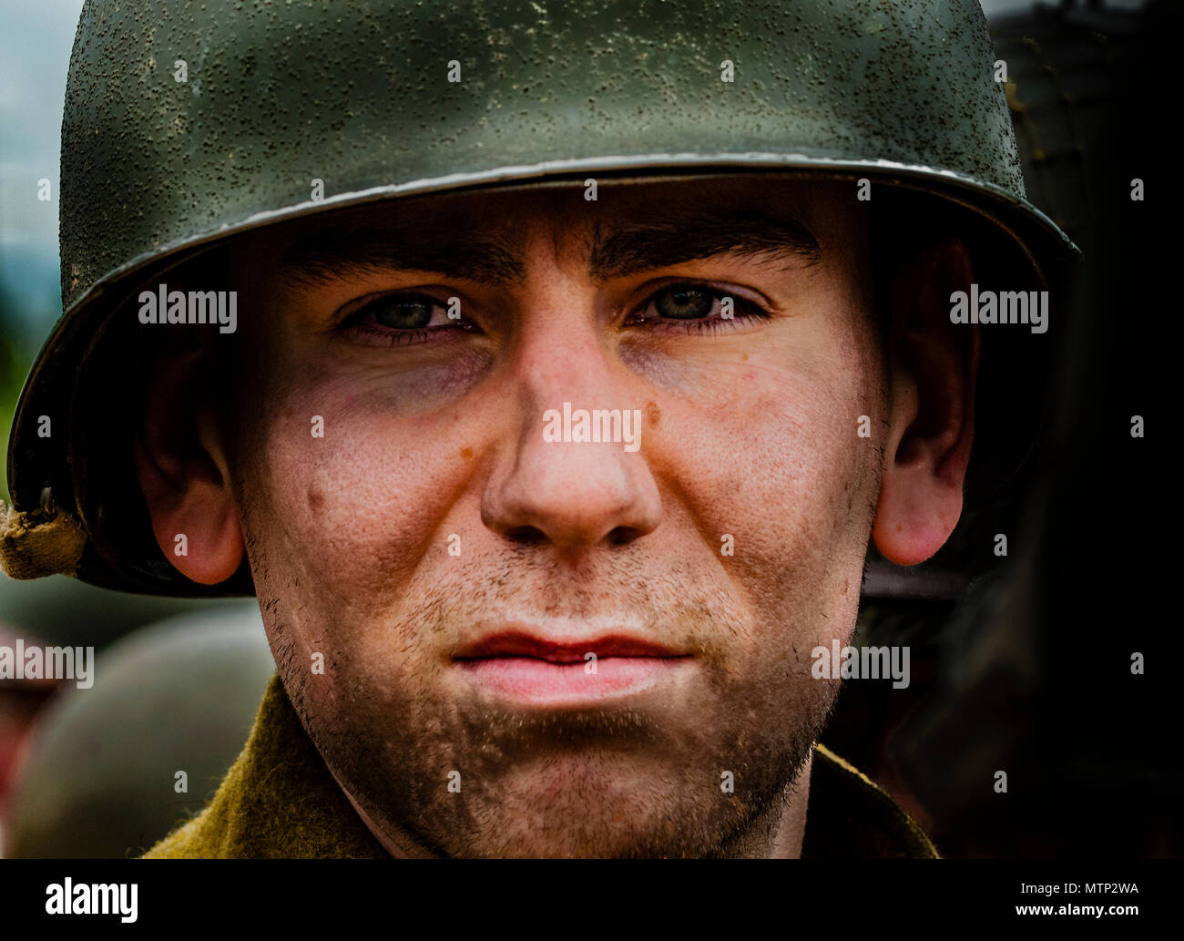 Portrait of an American GI soldier from World War Two with a dirty face ...