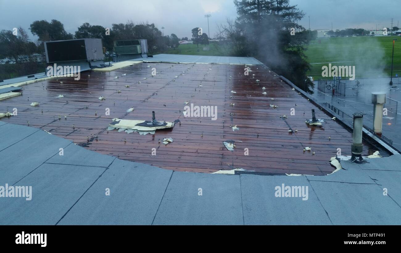 Severe winds and rain damaged a large portion of the roof above Travis ...