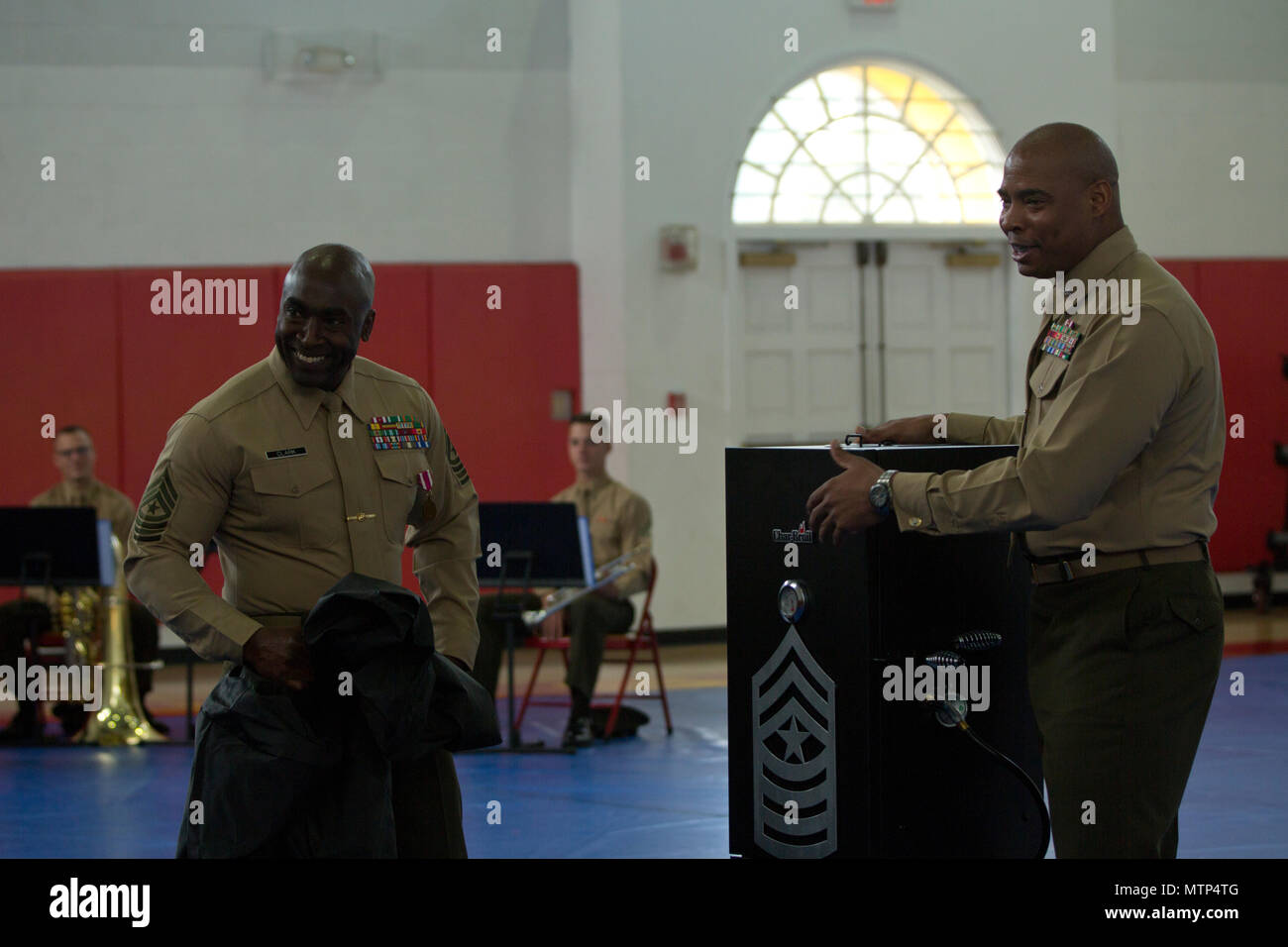 U.S. Marine Corps Sgt. Maj. Bobby Clark II, left, offgoing sergeant ...
