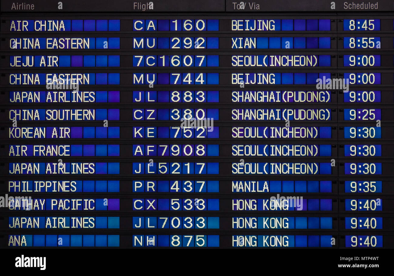 Airport board showing departures and arrivals to various cities Stock ...