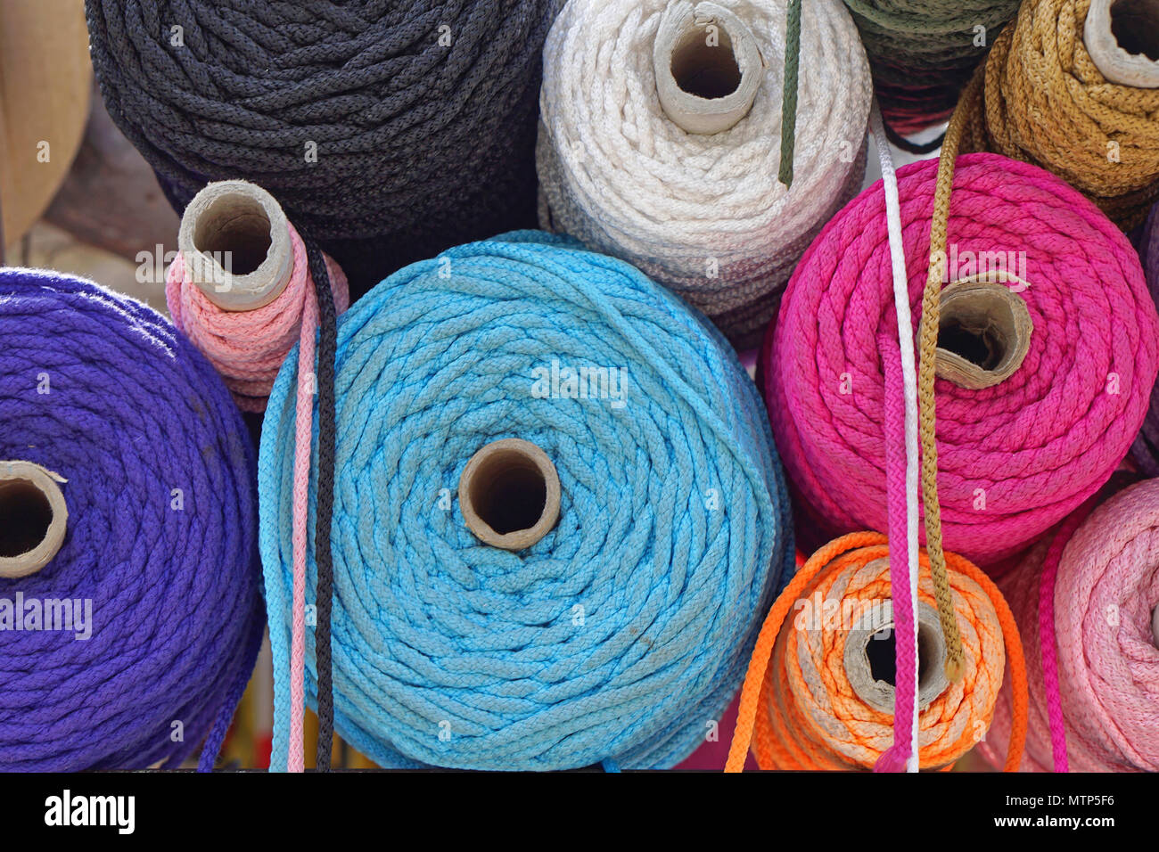 Various color ropes and yarns on coils Stock Photo - Alamy