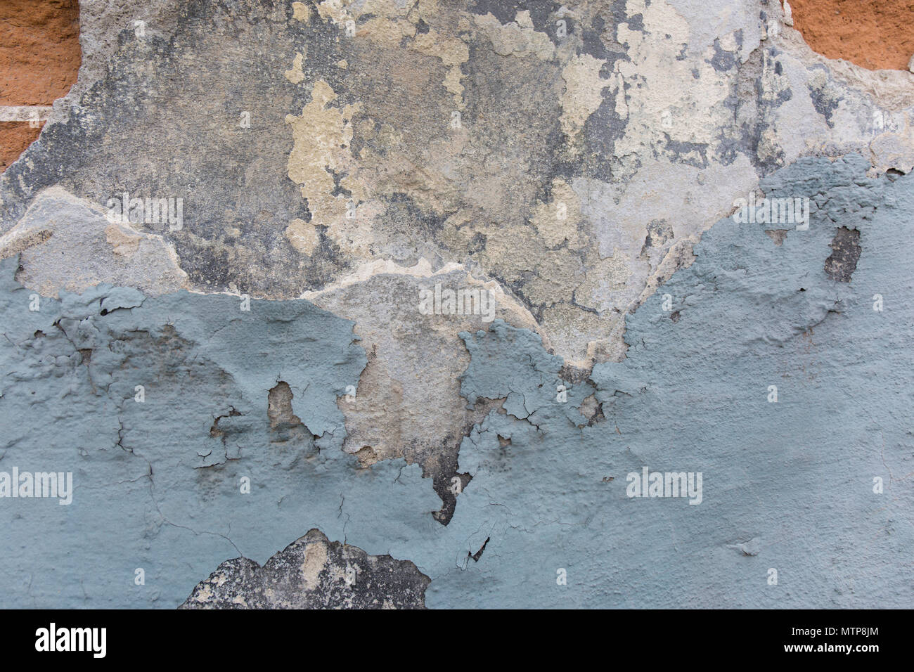 Blue paint peeling plaster gunge wall Stock Photo - Alamy