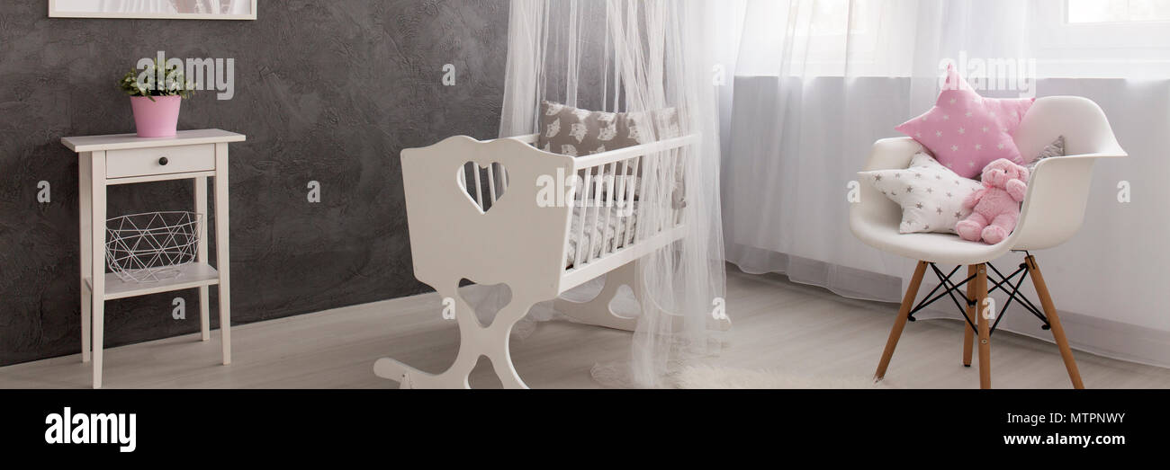 Very bright and delicate infant's room with a canopy cradle in the ...