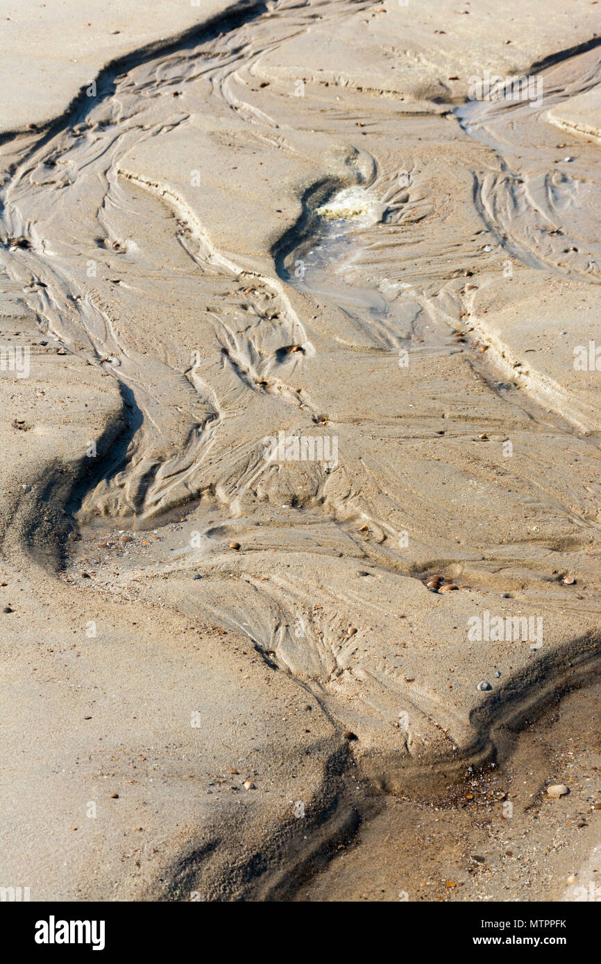 Beautiful background with wave patterns in wet sand on the beach Stock ...