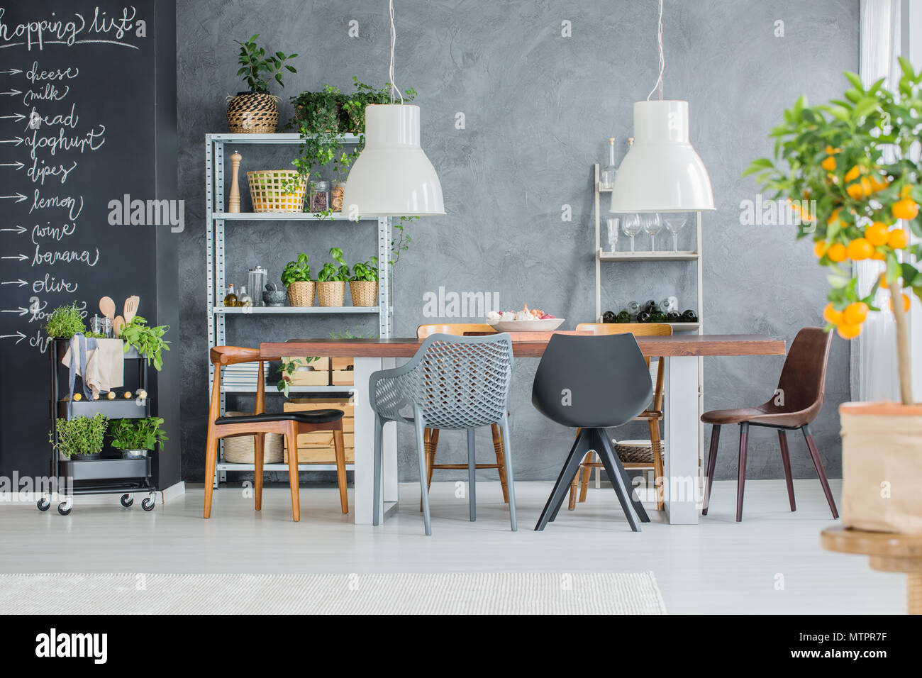Big communal table in loft dining room Stock Photo - Alamy