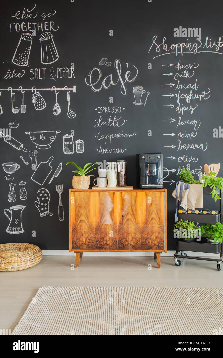 Chalk drawings on kitchen wall and coffee machine on cupboard Stock ...
