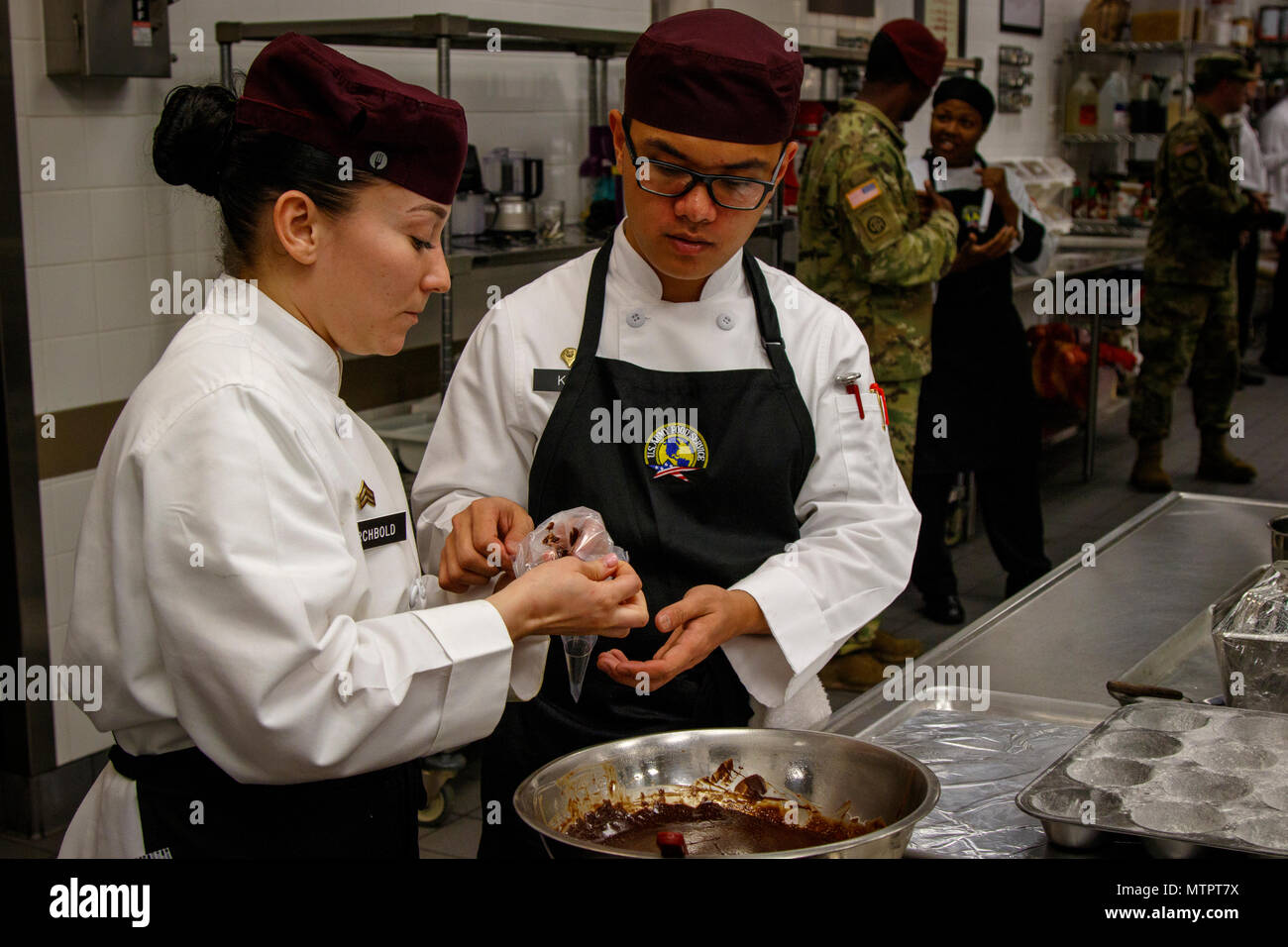 U.S. Army Sgt. Daniela Archbold (left), a culinary specialist, assigned ...