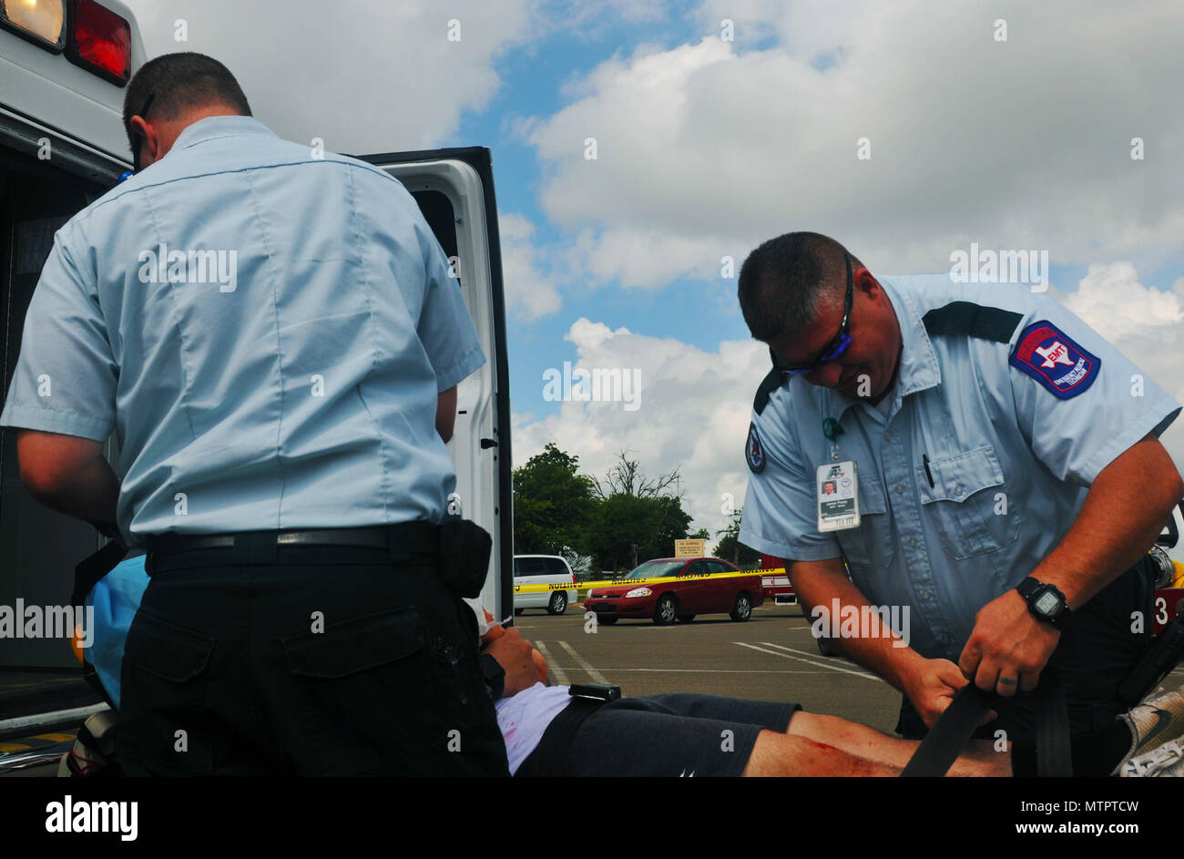 Justin Eschete, left, and James Posey, right, both emergency medical ...
