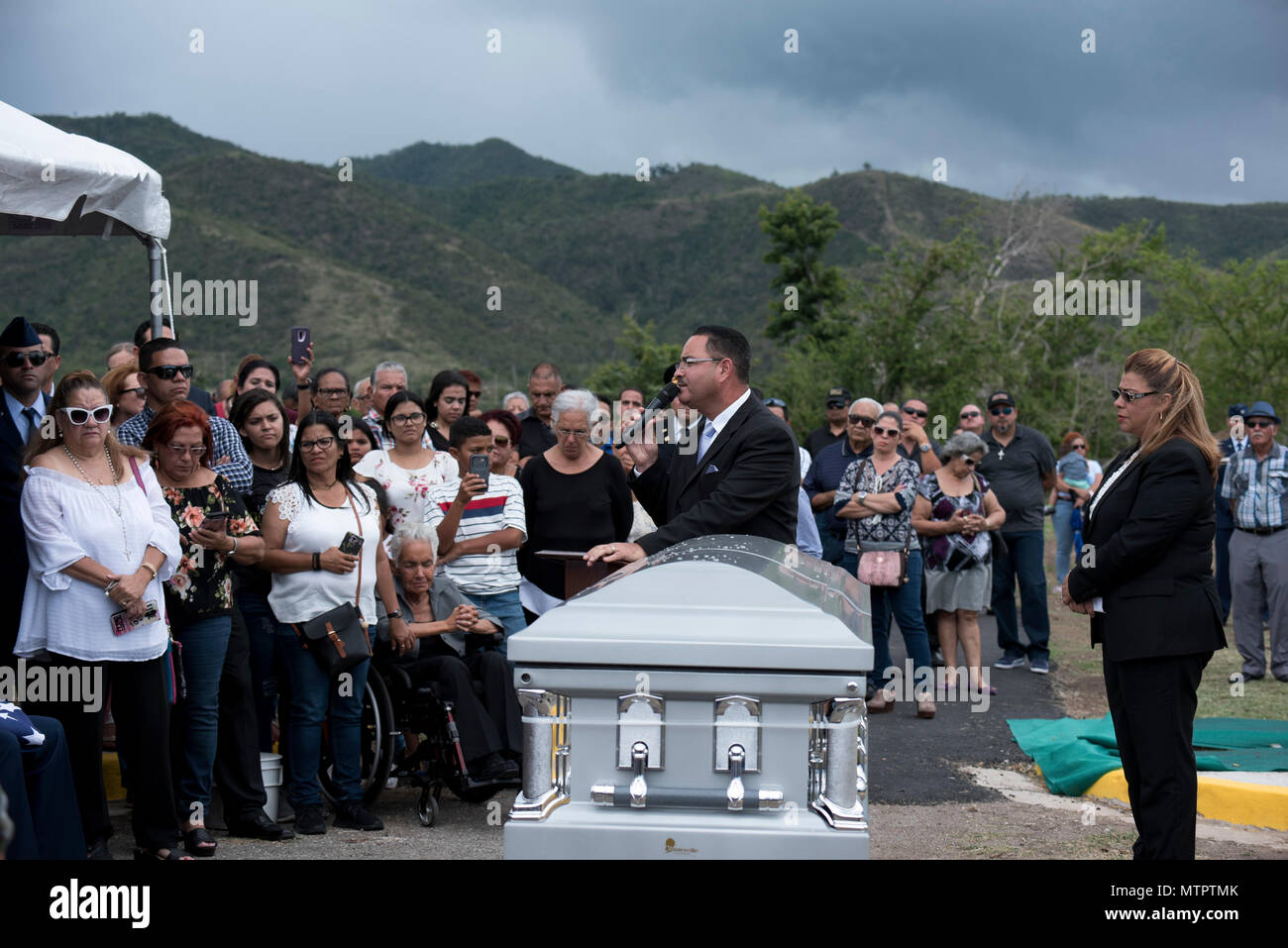 Ramón Hernández, mayor of Juana Diaz, speaks during a full military ...