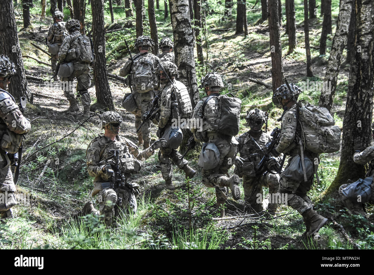 Leaders count their paratroopers through after a security halt on a ...