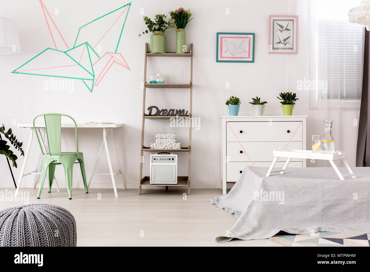 Original origami decoration in bright bedroom interior Stock Photo - Alamy