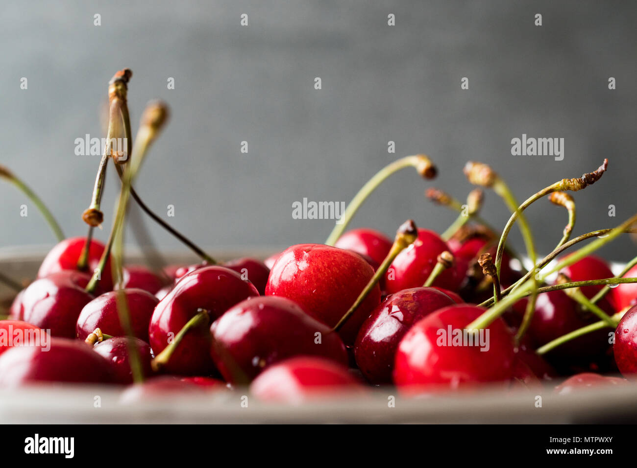 Raw Red Organic Cherries in Metal Collander. Organic Summer Fruit Stock ...