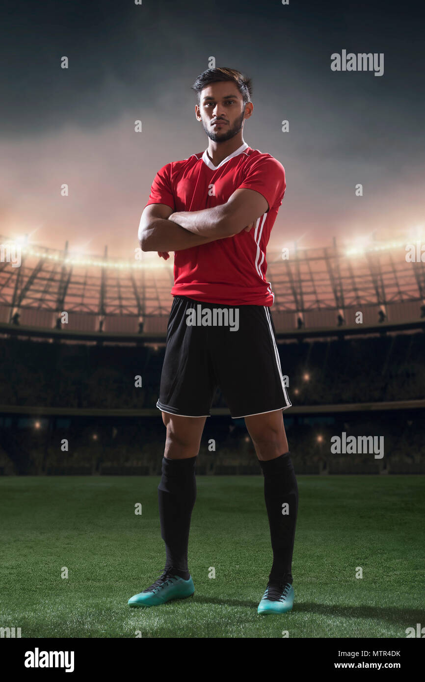 Football player standing portrait with stadium in backgorund Stock ...