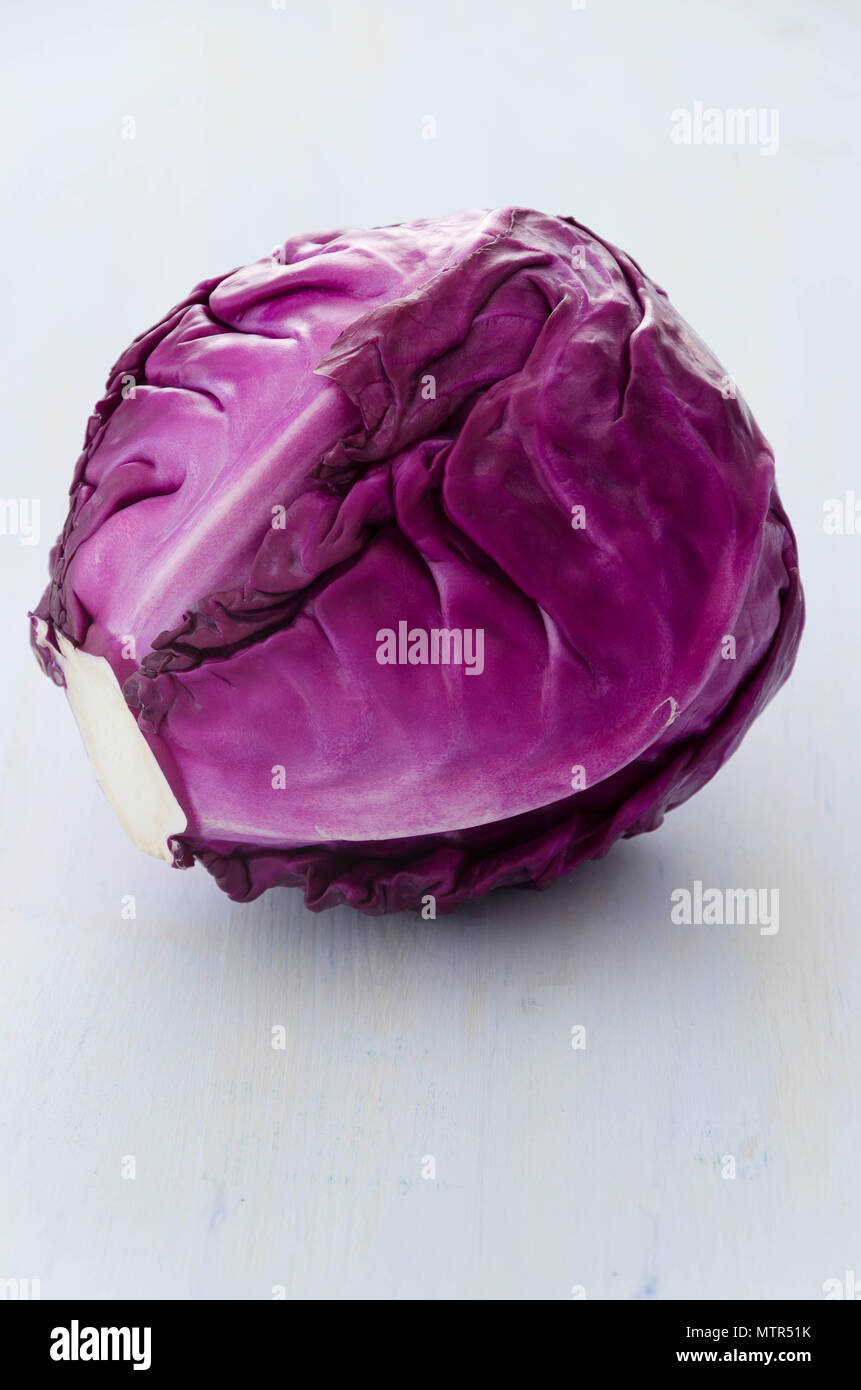 Red cabbage on light blue wooden background Stock Photo - Alamy