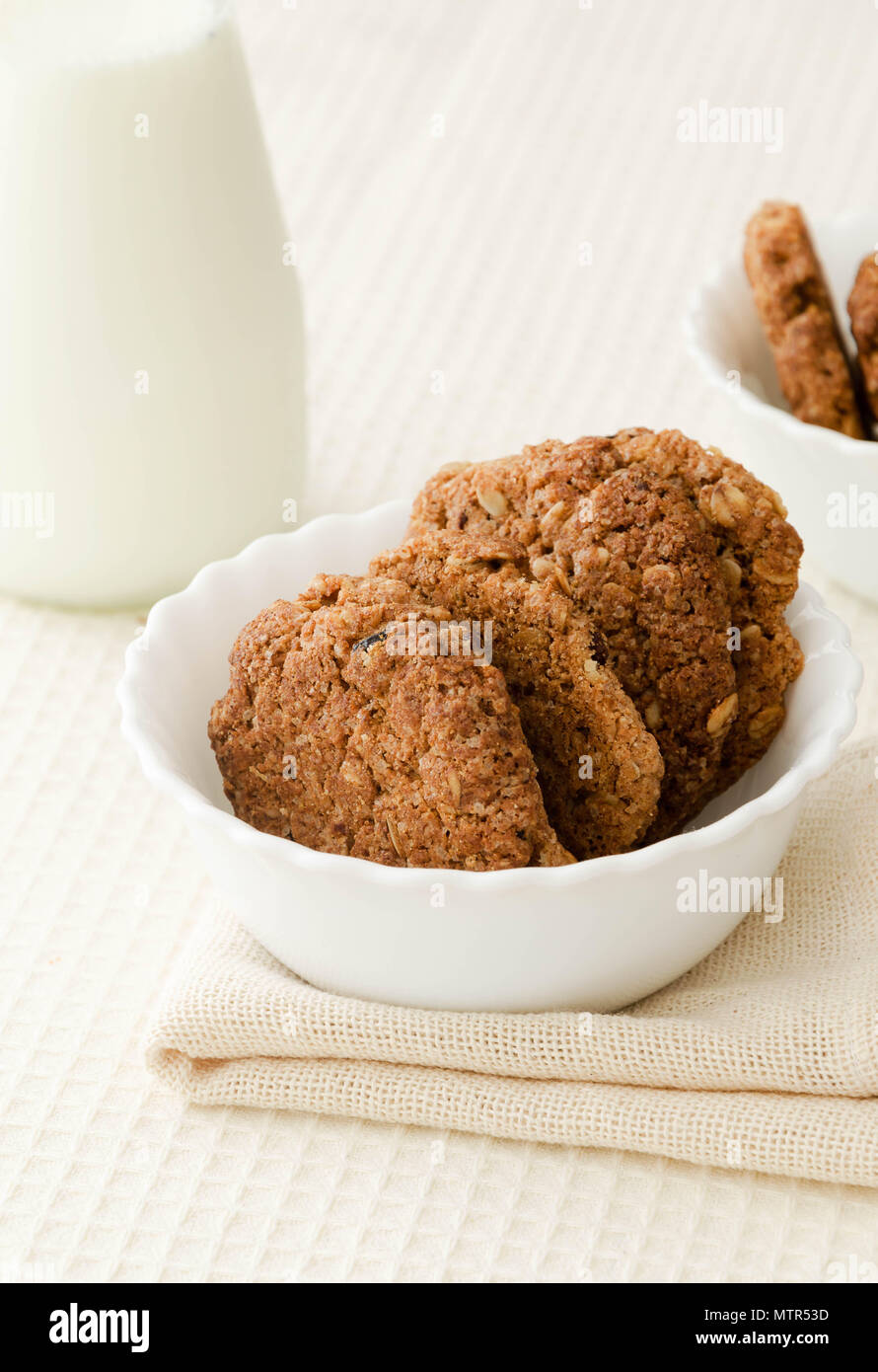 Homemade cookies in white bowl over cloth material Stock Photo - Alamy