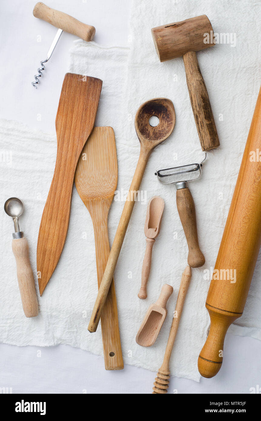 Collection of kitchen utensils over white cloth, above view Stock Photo ...