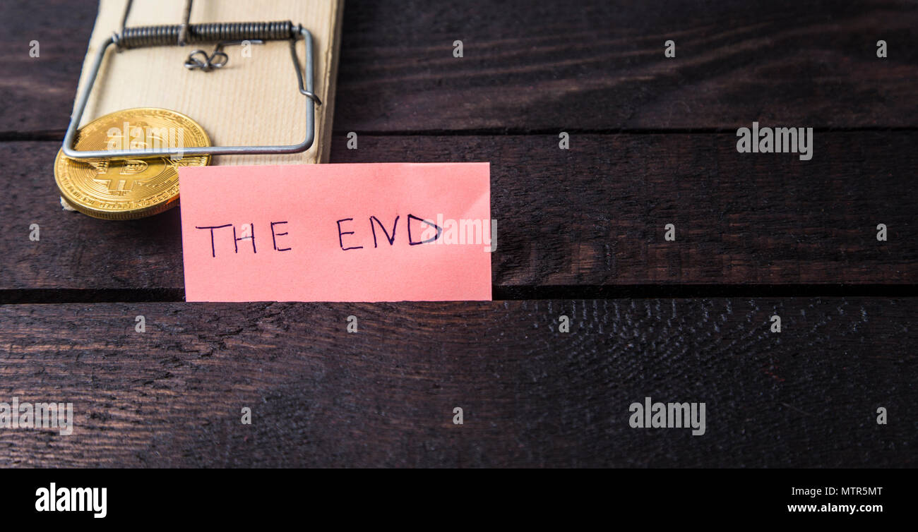 bitcoin in mouse trap and the word: THE END Stock Photo - Alamy