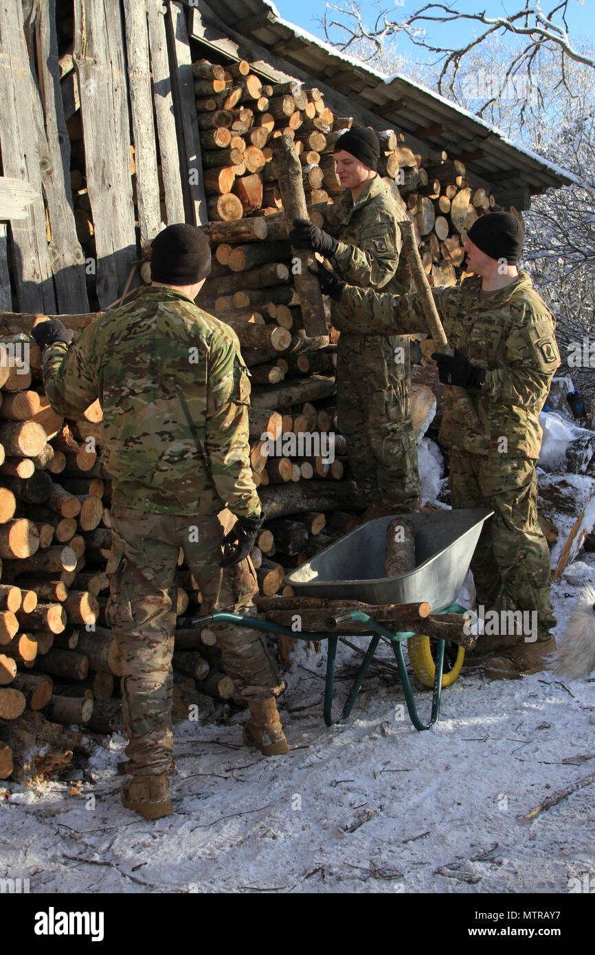 CAMP ADAZI, Latvia – Spc. Evan Kellogg [left], Sgt. Michael Chadwick ...