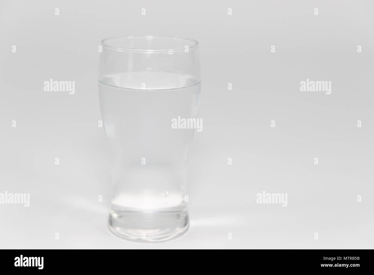 Water glass isolated on white Stock Photo - Alamy