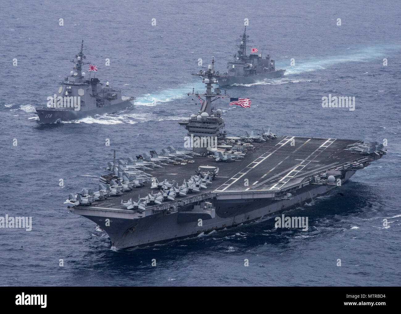 PHILIPPINE SEA (April 26, 2017) USS Carl Vinson (CVN 70), foreground ...