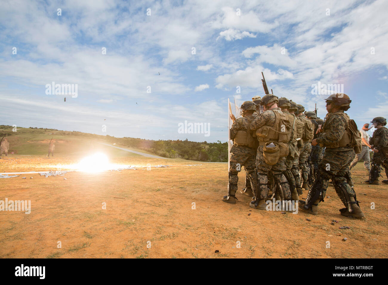 Students with the Non-Lethal weapons Instructor Course form a shield ...