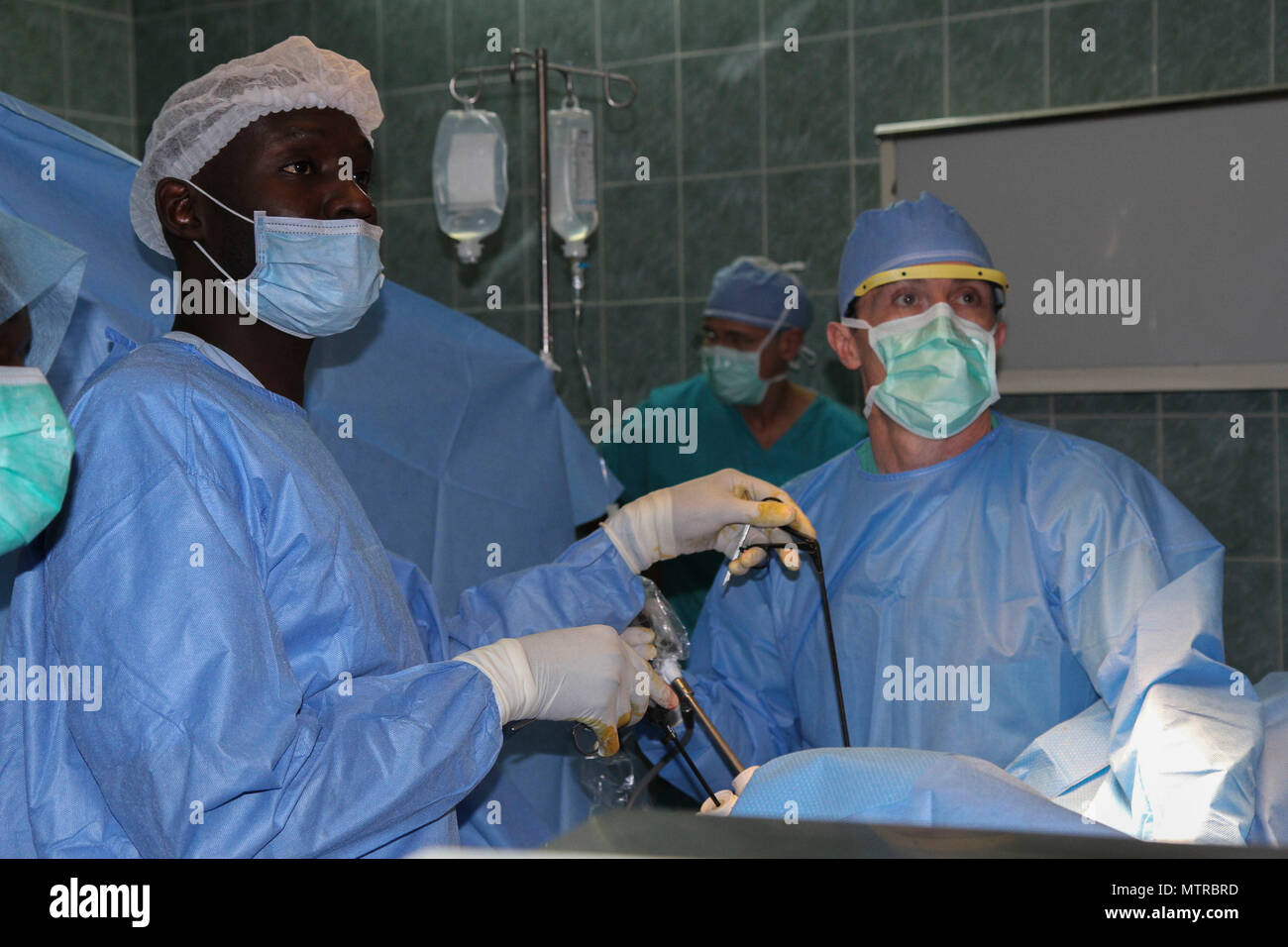 U.S. Air National Guard Maj. Anthony Donaldson,right, a surgeon from ...