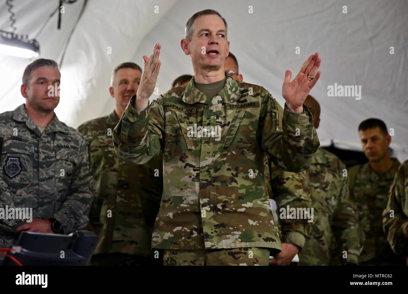 Lt. Gen. Sean MacFarland, commanding general, III Corps, asks a ...