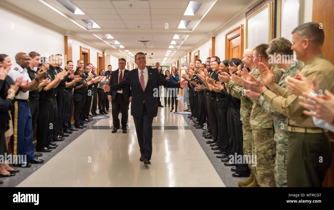 On his final day in office, the Secretary of Defense exits the Pentagon ...