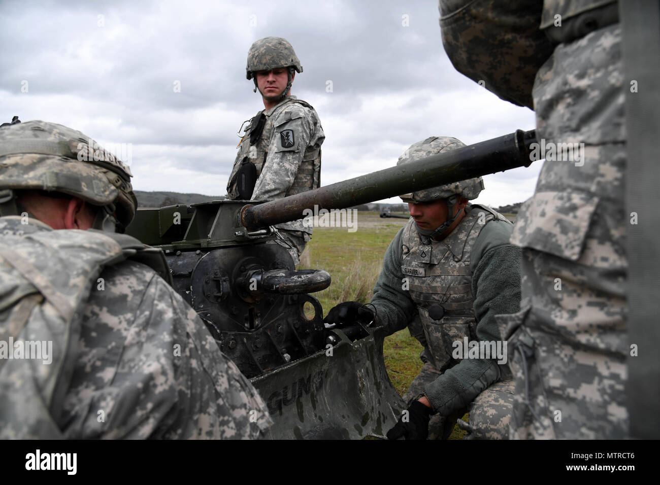 Alpha and Bravo Battery, 1-143rd Field Artillery, prepare an M119A3 105mm Howitzer at Camp ...