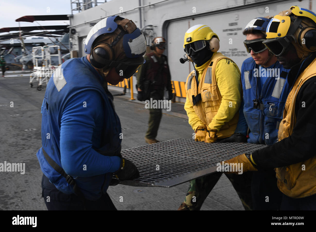 170119-N-KD168-058 ATLANTIC OCEAN (Jan. 19, 2017) Sailors carry a metal ...