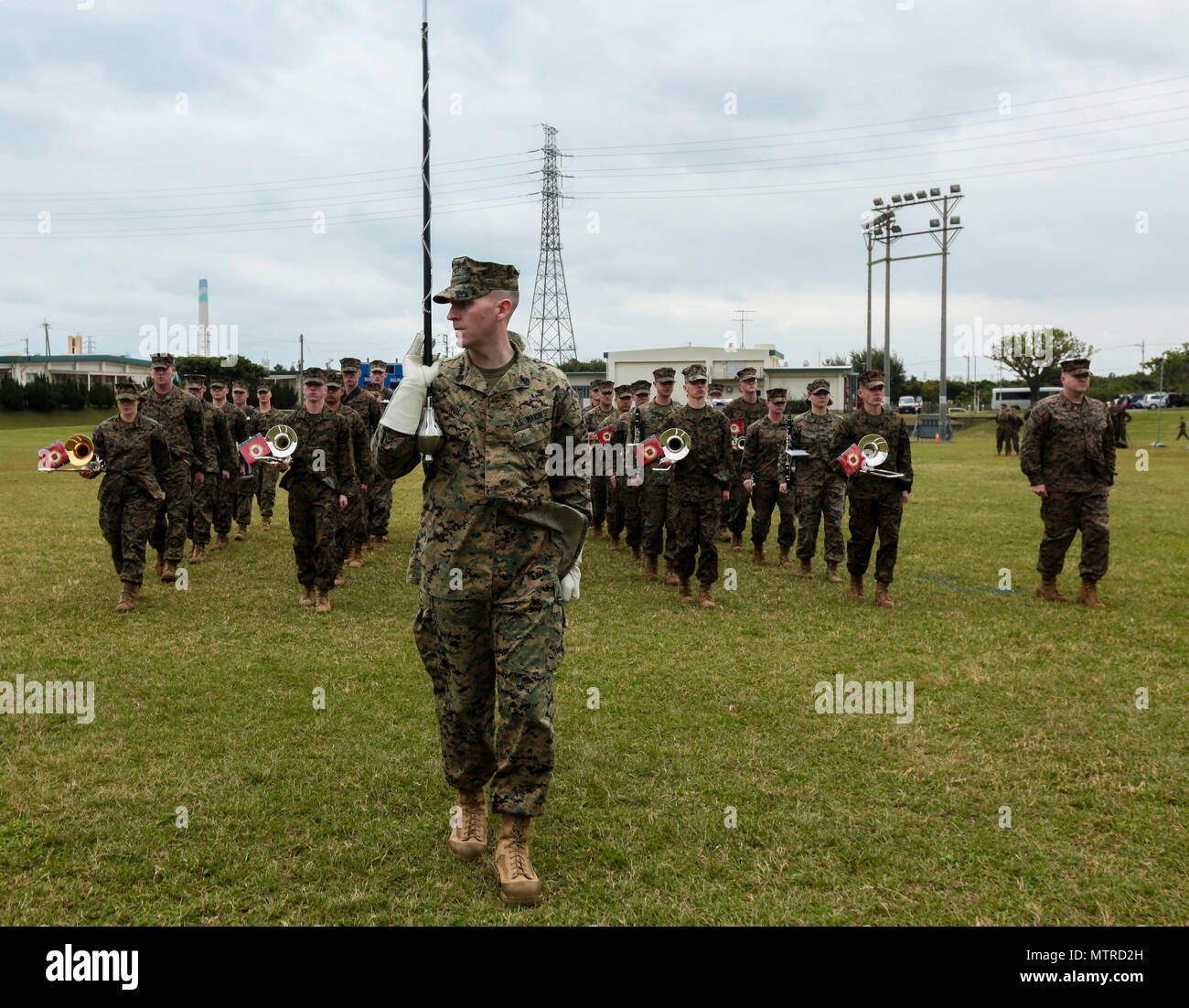 The III Marine Expeditionary Force band marches during a change of ...