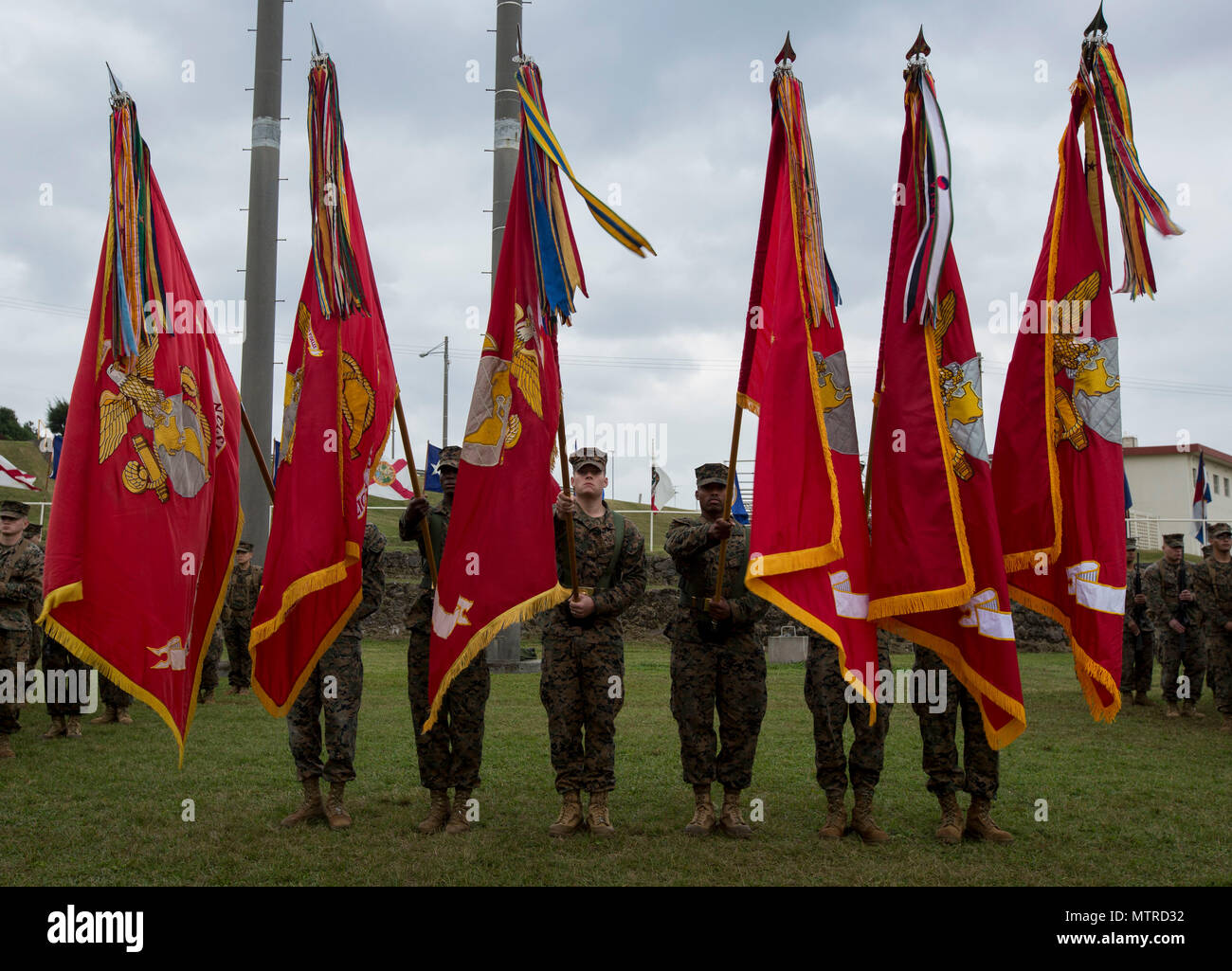 U.S. Marines carry the Marine Corps colors during a change of command ...