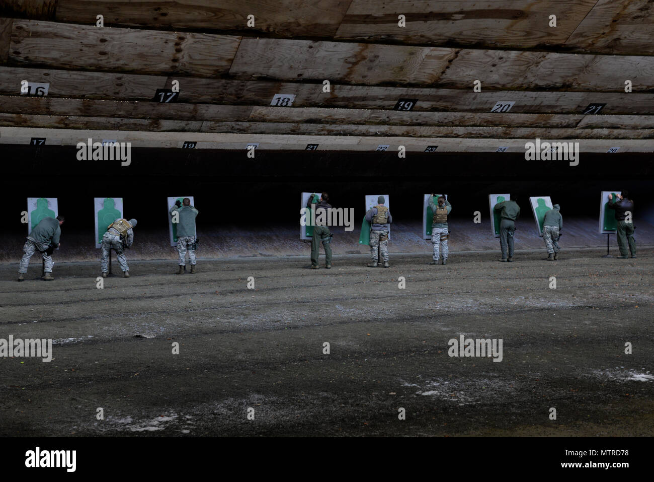 Airmen set up their targets before shooting the Beretta M9 handgun at ...