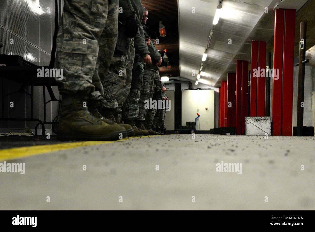 Airmen line up before shooting the Combat Arms Training and Maintenance ...