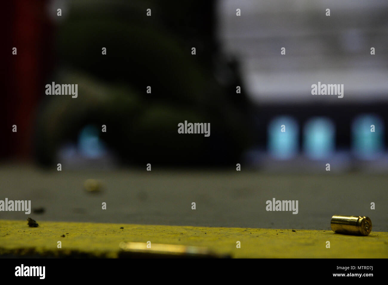 A shell casing rests on the ground at the Combat Arms Training and ...