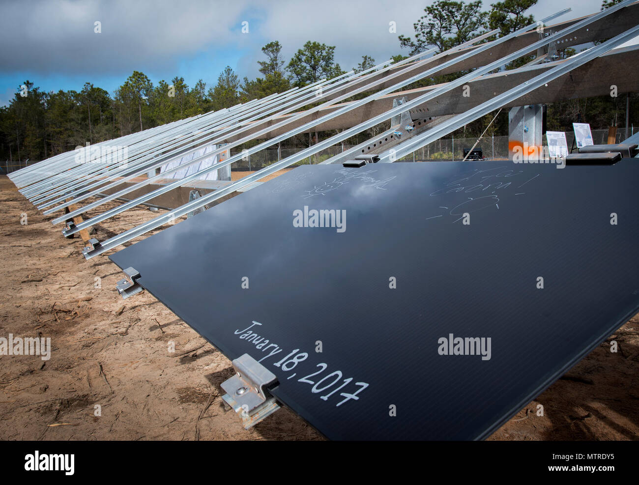 The first of the eventual 375,000 solar panels sits on it rack after a ...