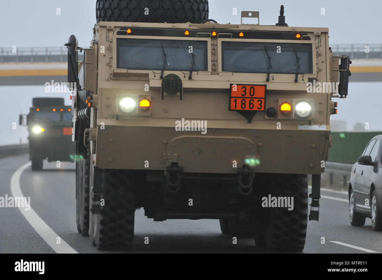 A U.S. Army convoy from Company A, 64th Brigade Support Battalion, 3rd ...