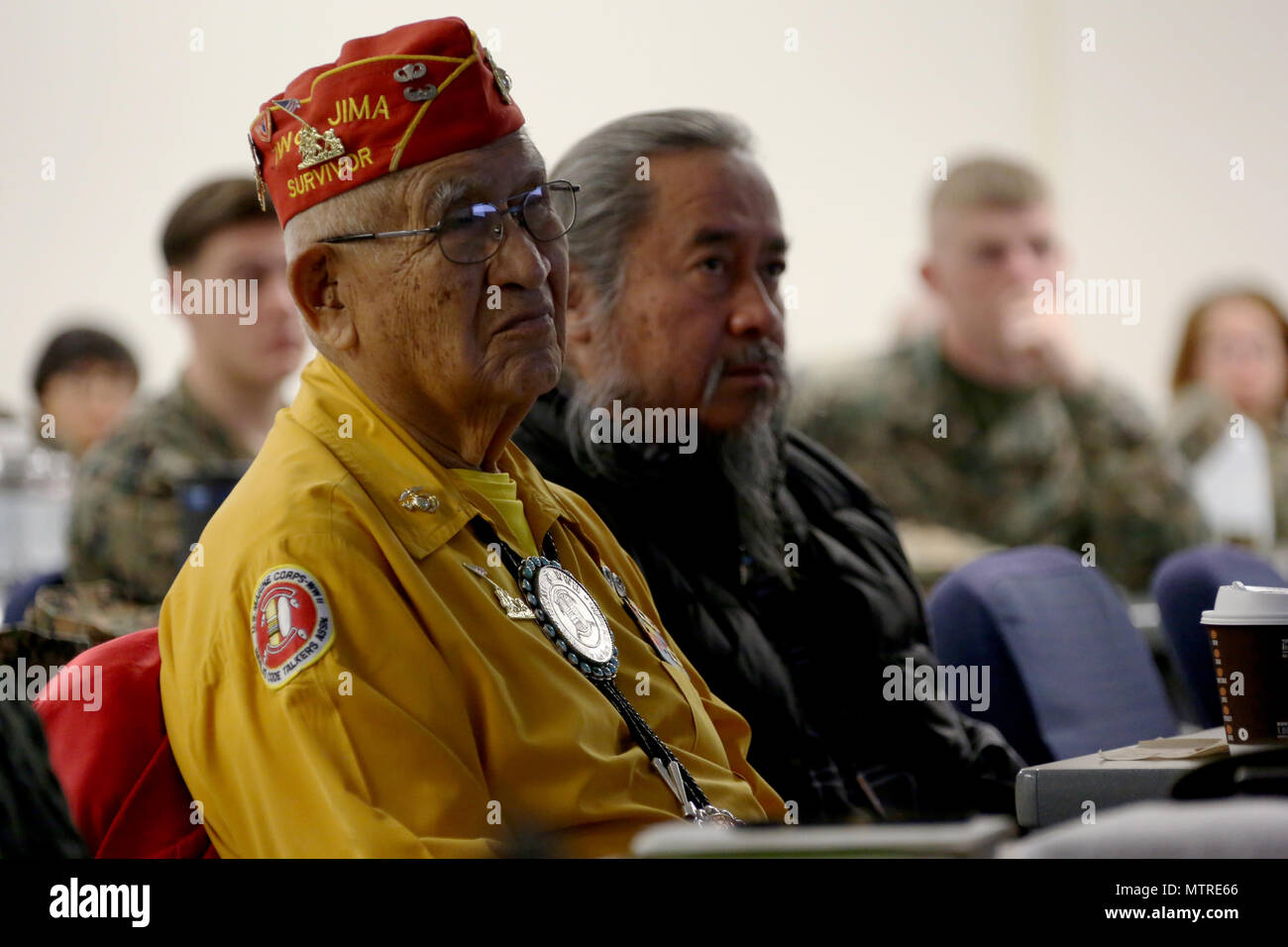 Navajo code talker Thomas Begay, left, listens to a speech given by ...