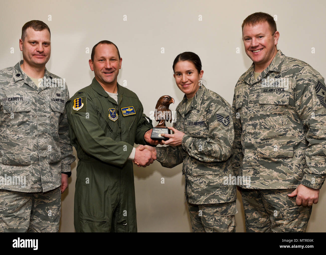 Col. Gentry Boswell, the 28th Bomb Wing commander, presents Staff Sgt ...