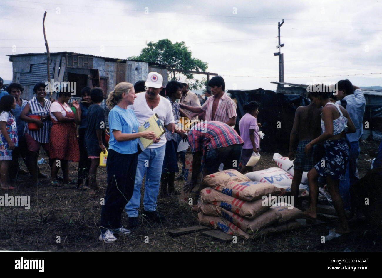 women and men gathering supplies Stock Photo - Alamy